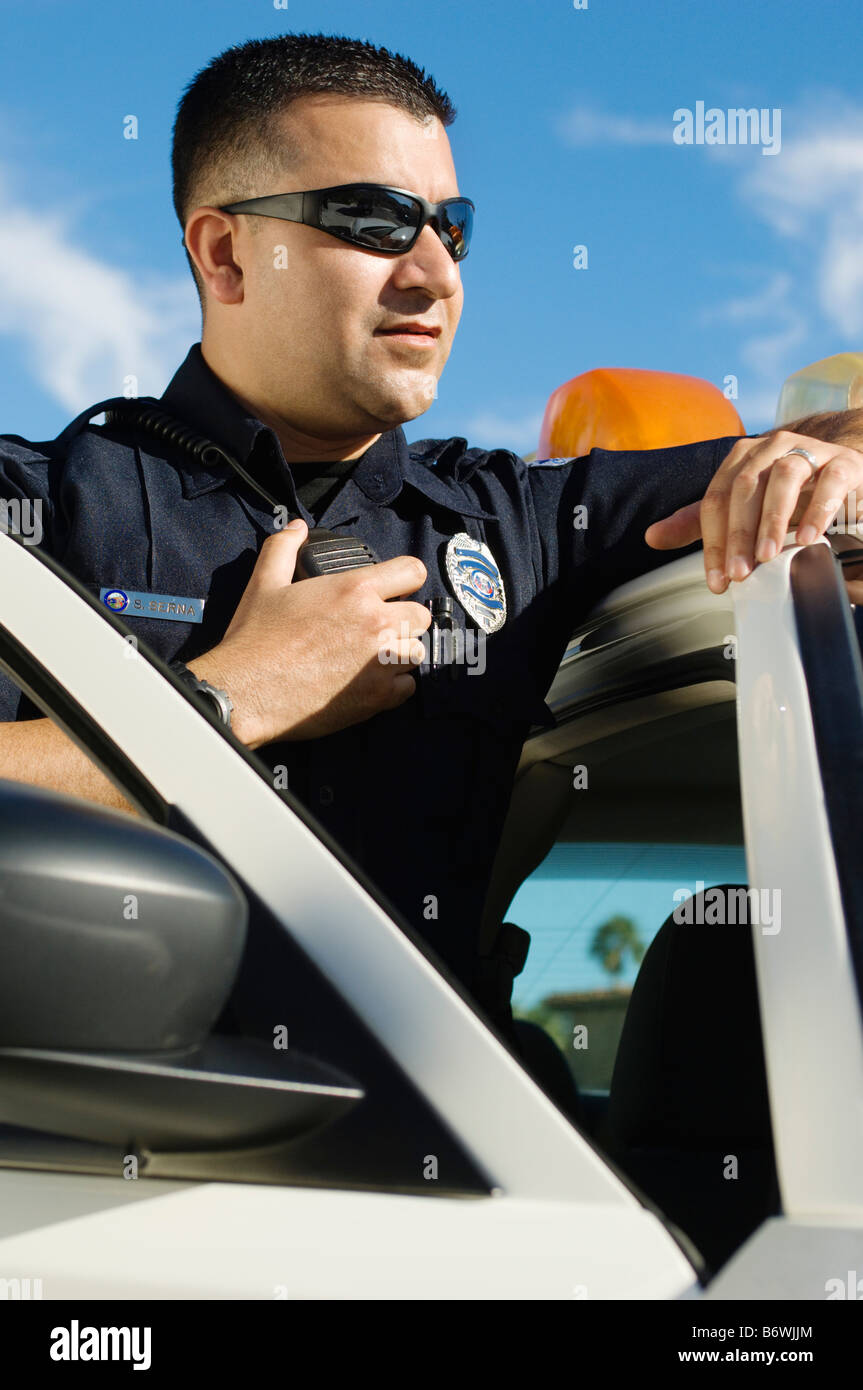 Police Officer Using Two-Way Radio Stock Photo - Alamy