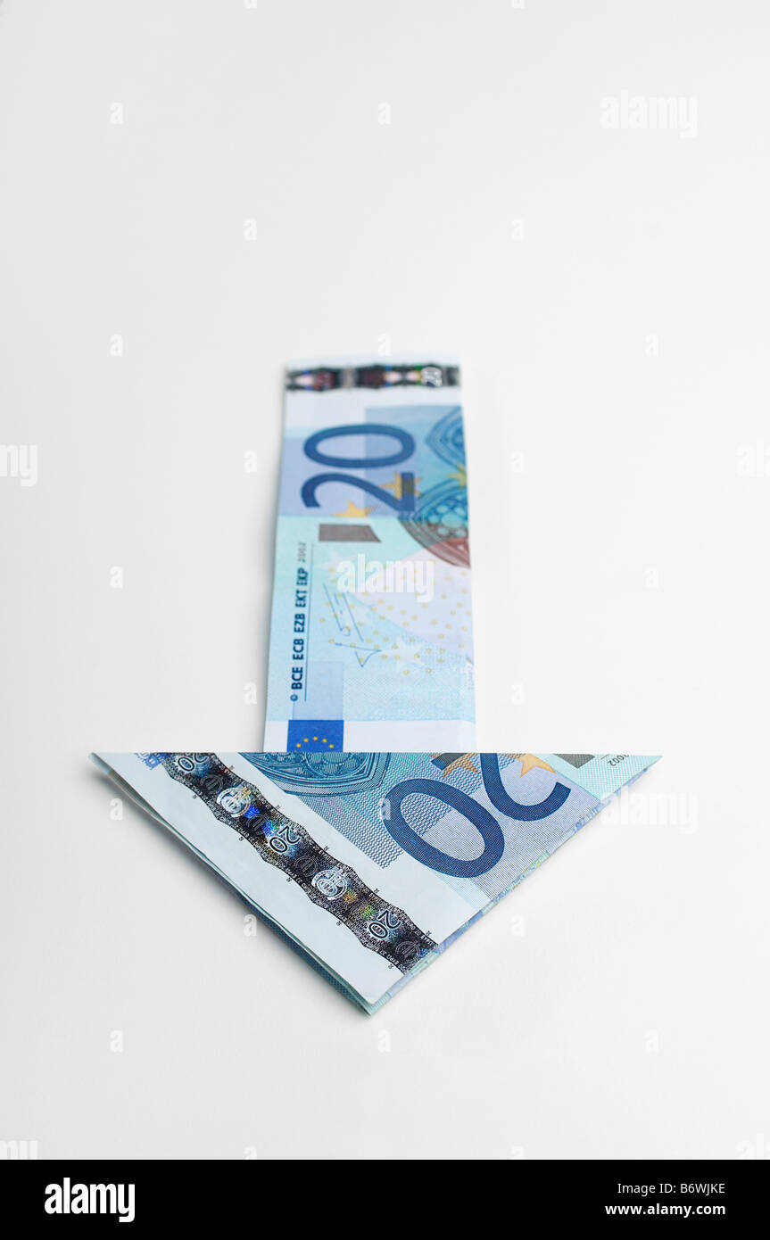 Arrow Made of Money Stock Photo - Alamy