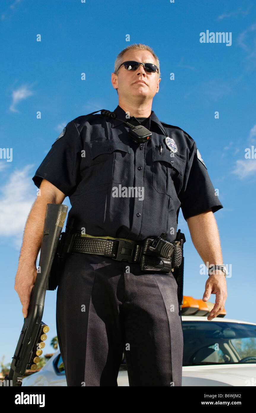 Police Officer with Shotgun Stock Photo - Alamy