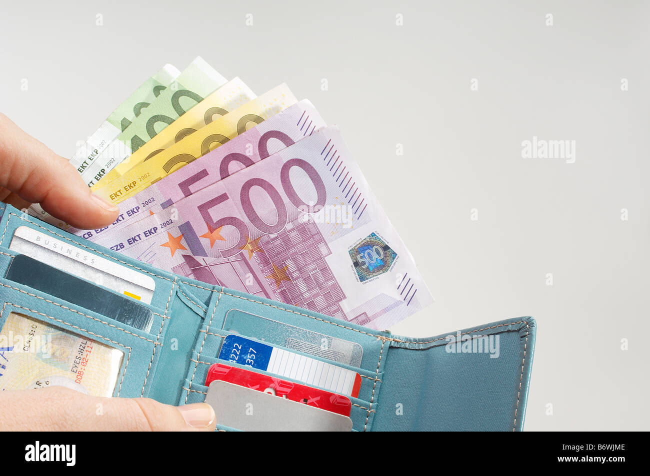 Wallet Full of Money Stock Photo - Alamy