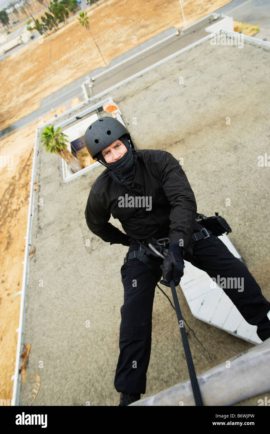 SWAT Team Officer Rappelling from Building Stock Photo - Alamy