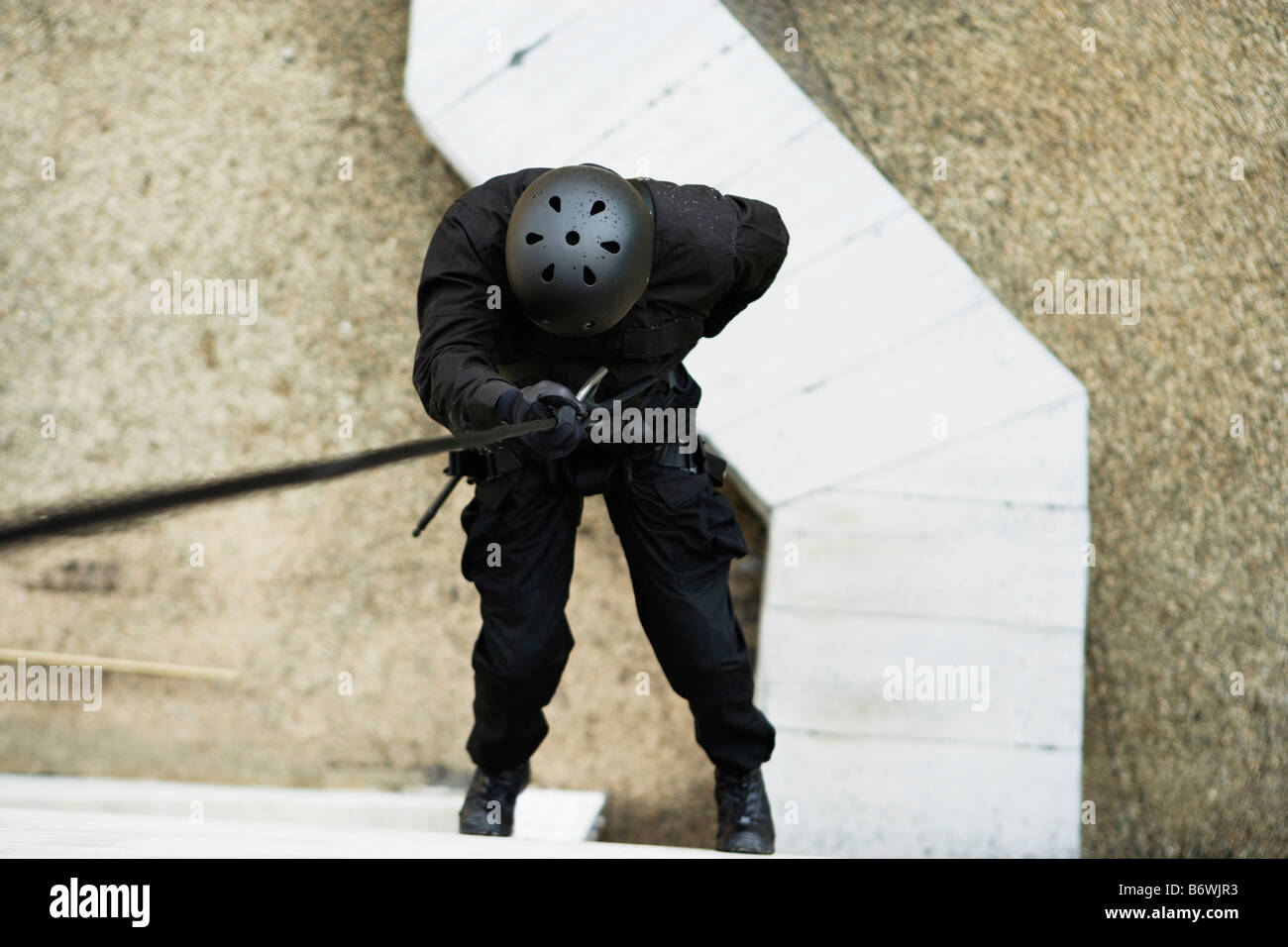SWAT Team Officer Rappelling from Building Stock Photo - Alamy