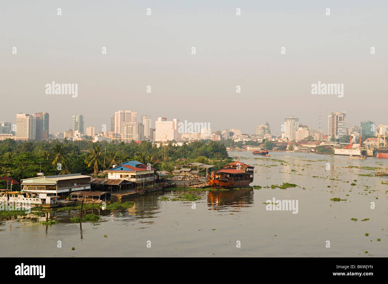 City Skyline Along River Stock Photo - Alamy