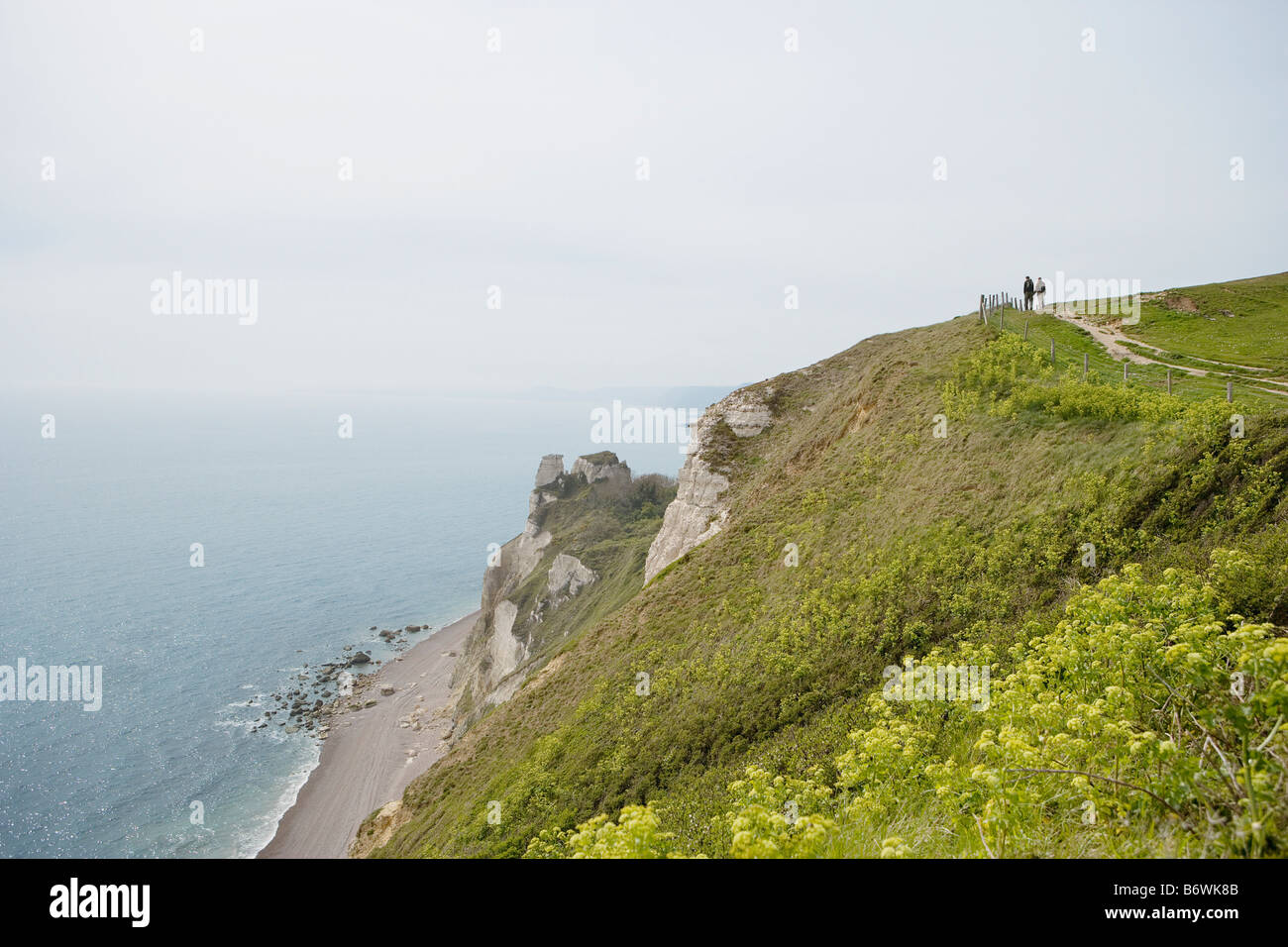 Couple on a Path Atop a Cliff Stock Photo - Alamy