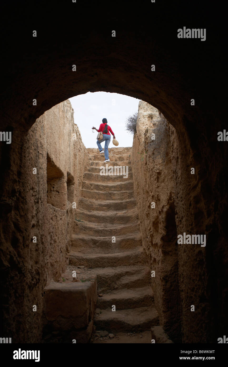 Woman Climbing Stairs in the Tombs of the Kings, Paphos, Cyprus Stock ...