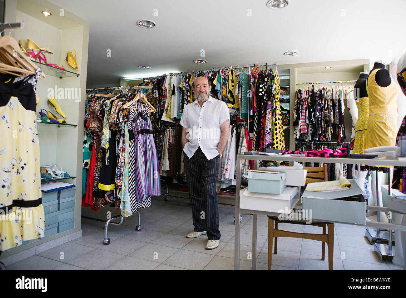 Shop Owner in Clothing Store Stock Photo - Alamy