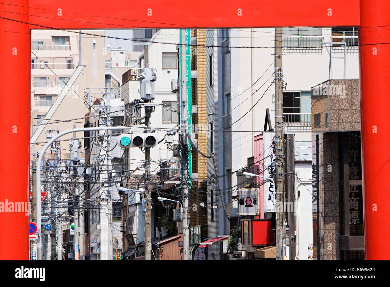 Electrical Lines and Street Light Seen Through Torii Gate Stock Photo ...
