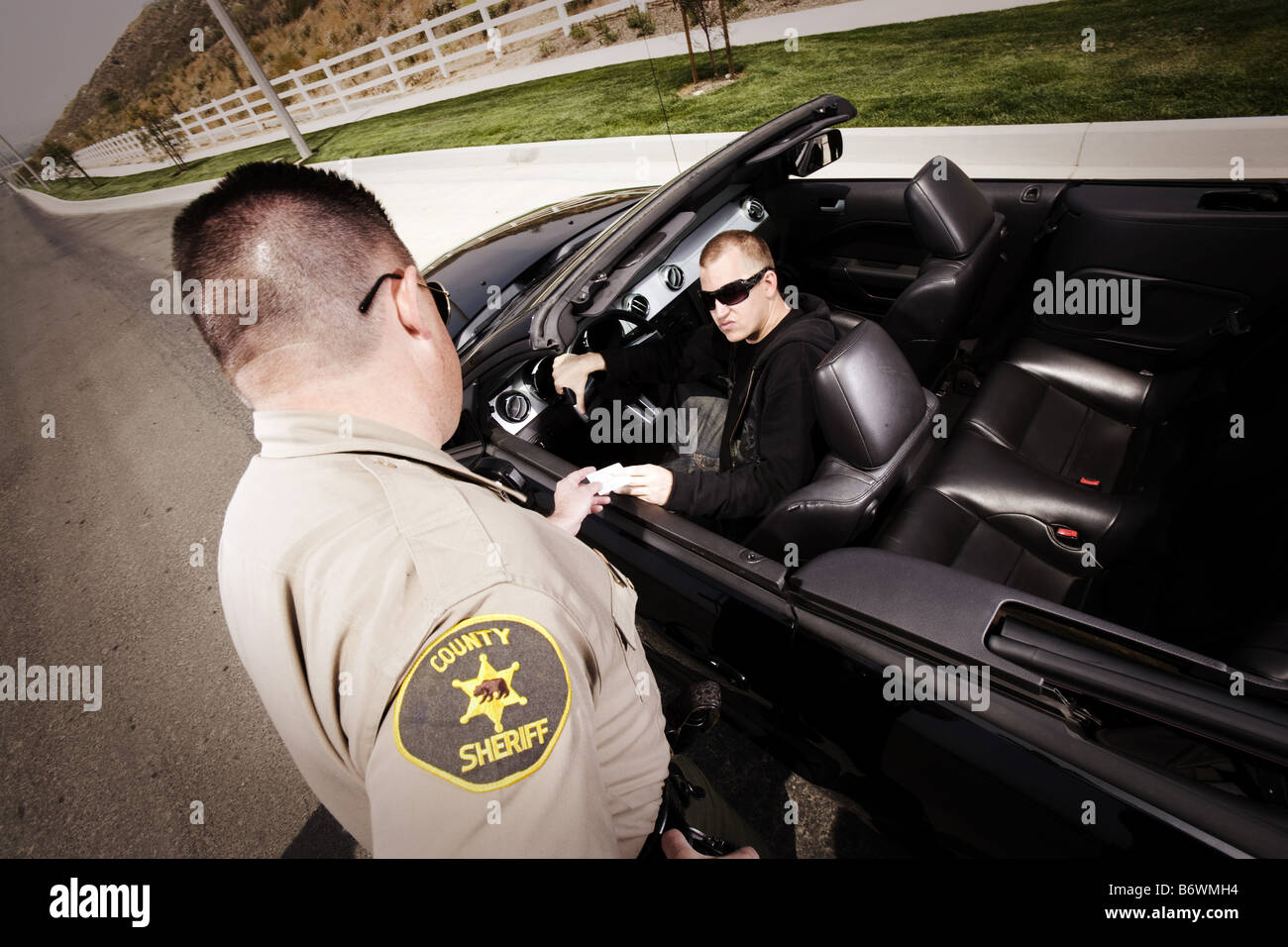 Police handing hi-res stock photography and images - Alamy