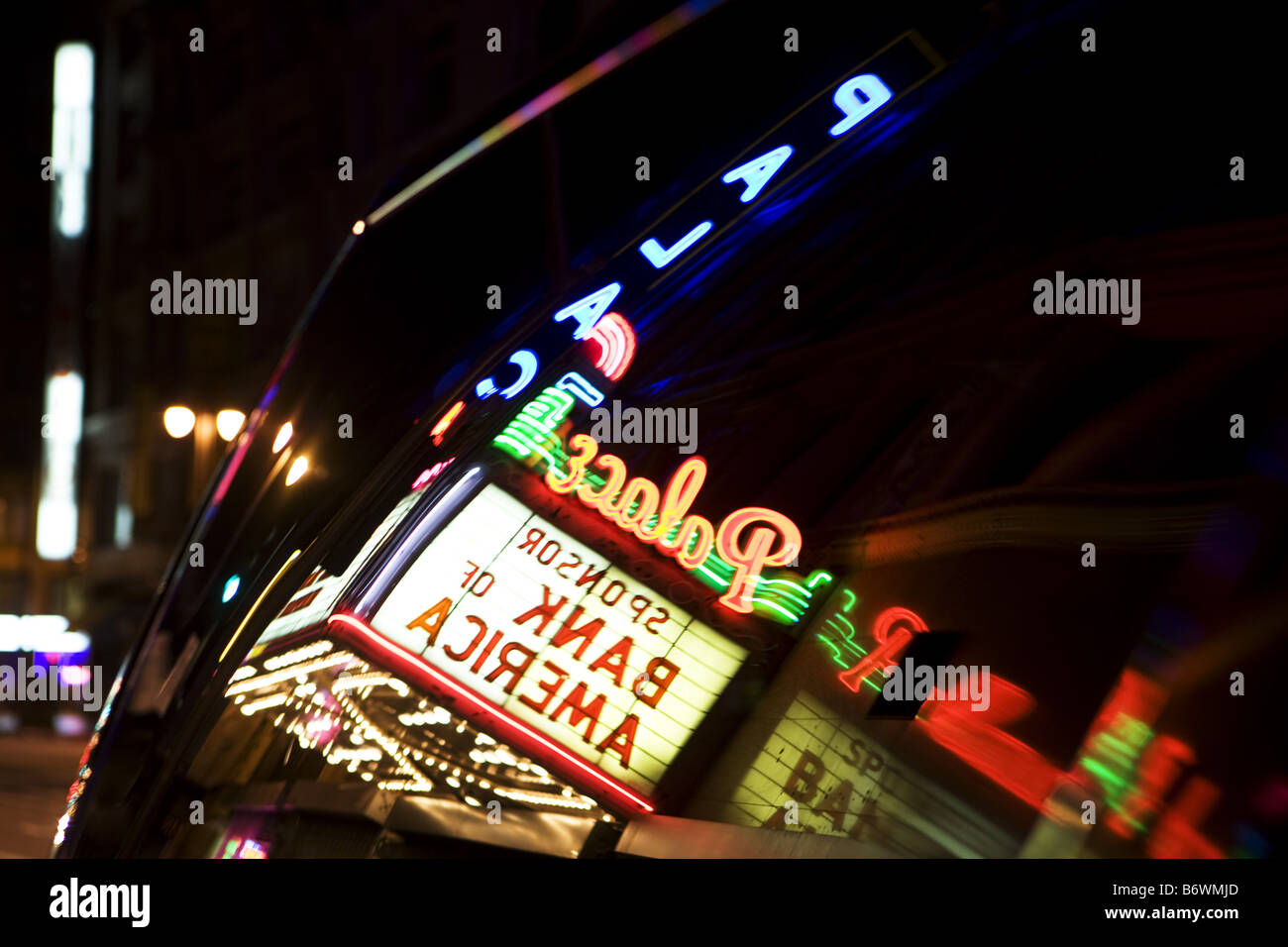 Reflection of neon lights on car at night Stock Photo - Alamy