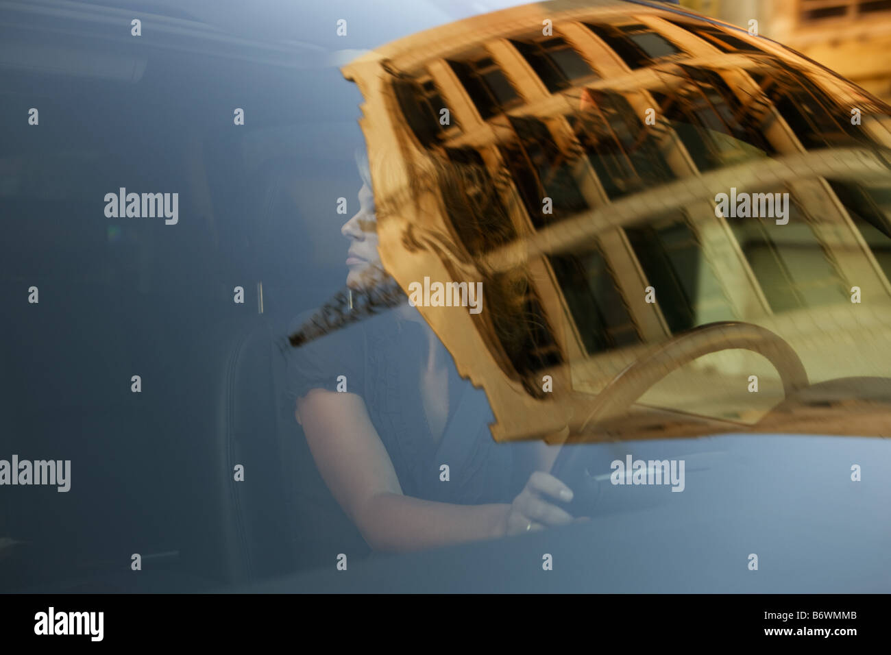 Reflection of downtown building on car windscreen Stock Photo - Alamy