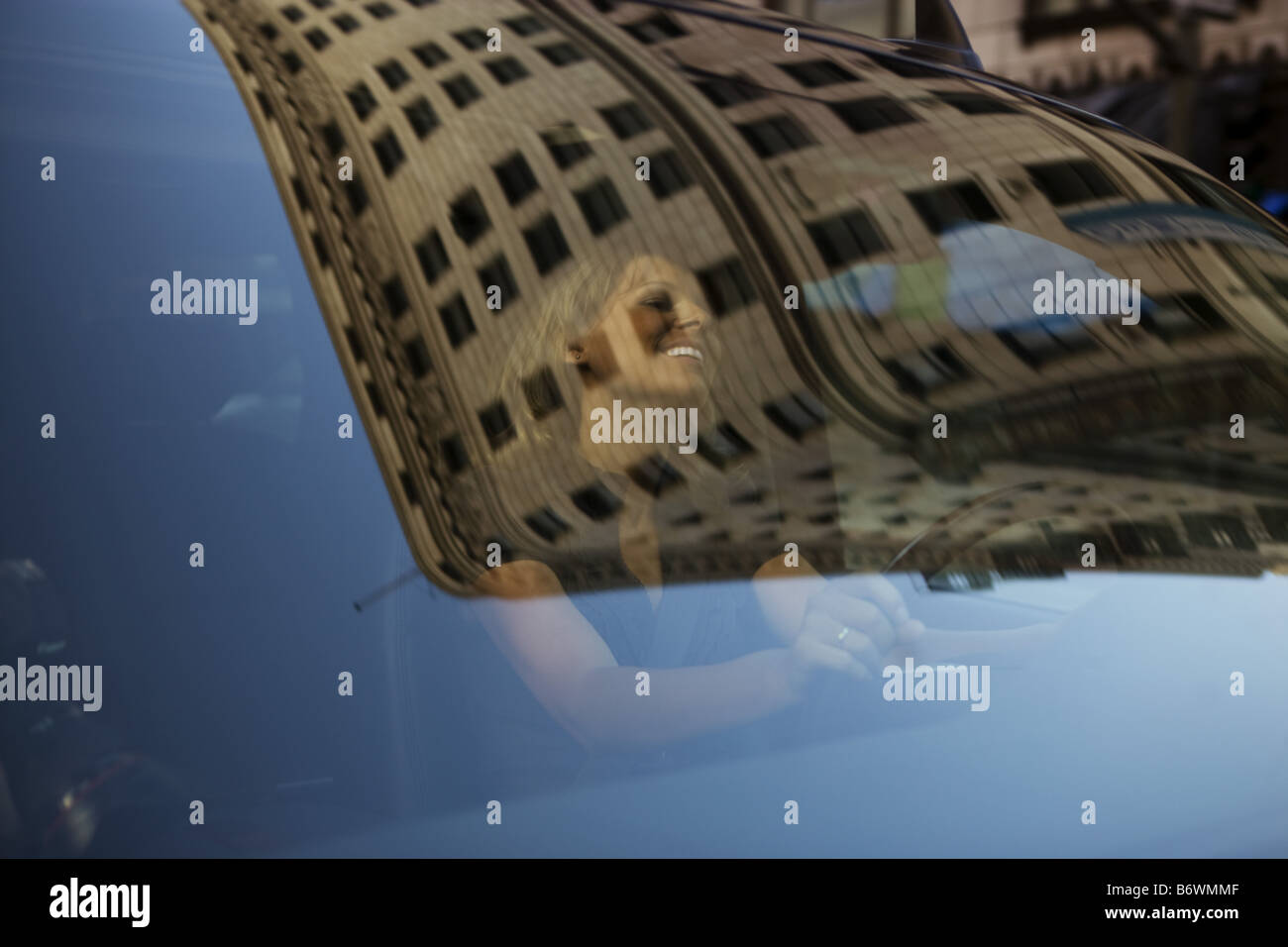 Reflection of downtown building on car windscreen Stock Photo - Alamy