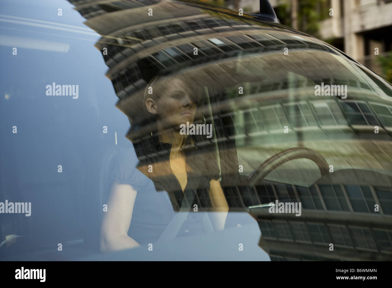 Reflection of downtown building on car windscreen Stock Photo - Alamy