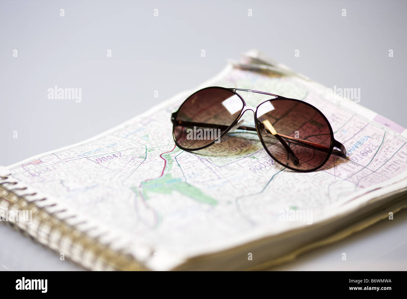 Sunglasses on page of Thomas guide map of Los Angeles Stock Photo - Alamy