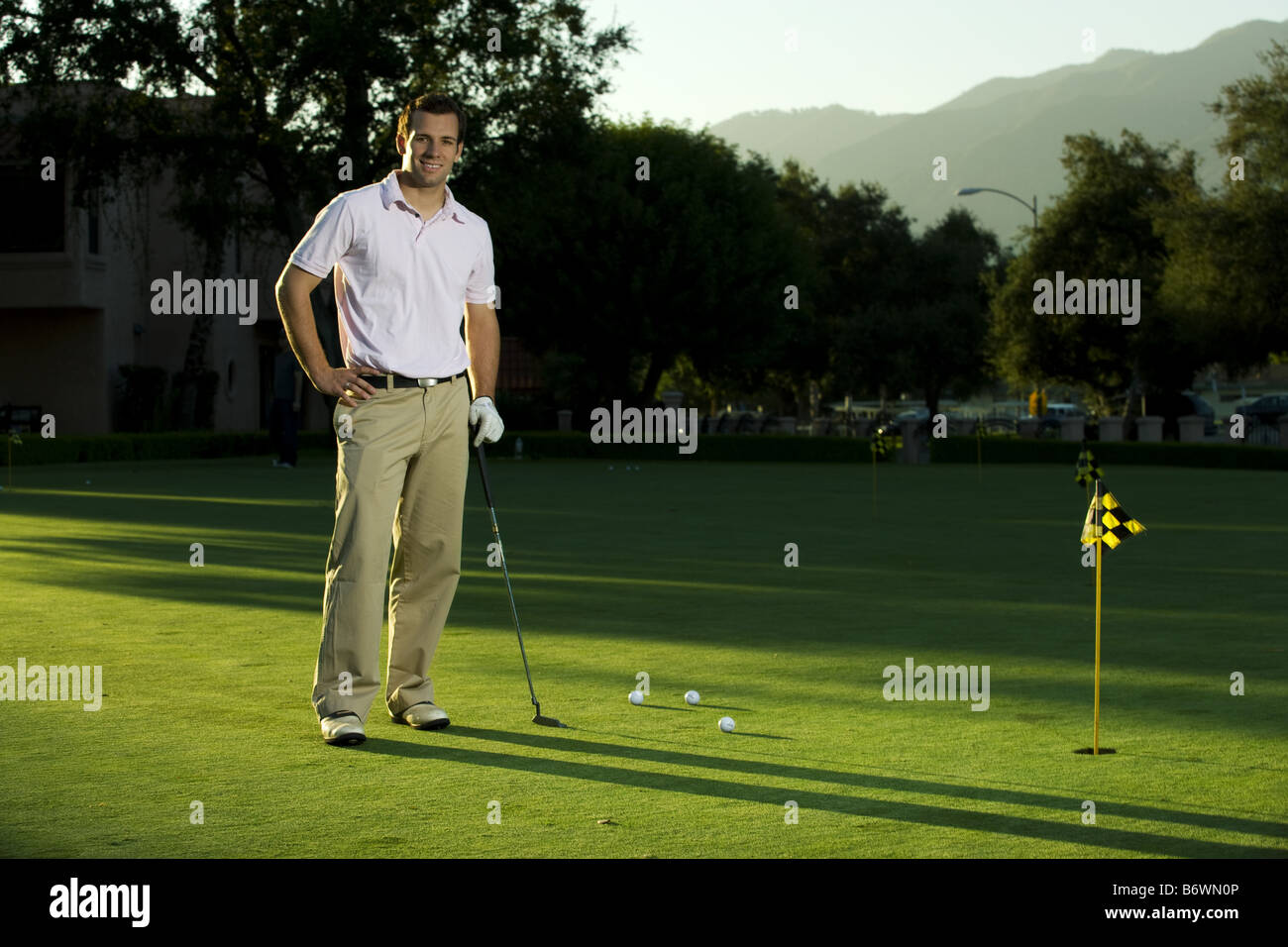 Golfer on golf course Stock Photo - Alamy