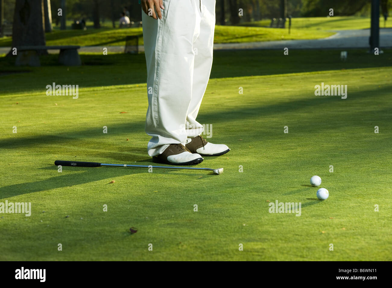 Golfer on golf course Stock Photo - Alamy