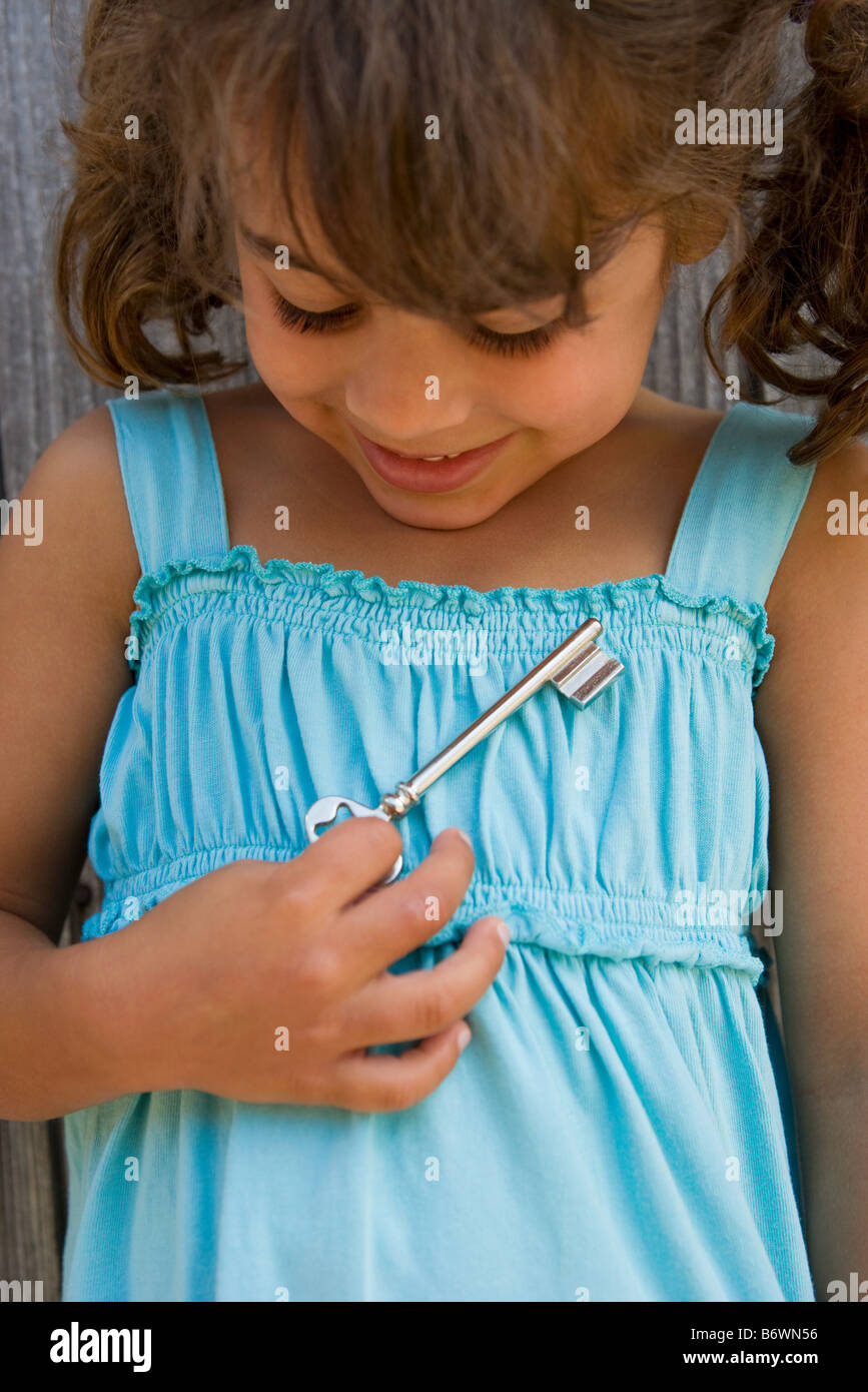Girl holding a key hi-res stock photography and images - Alamy