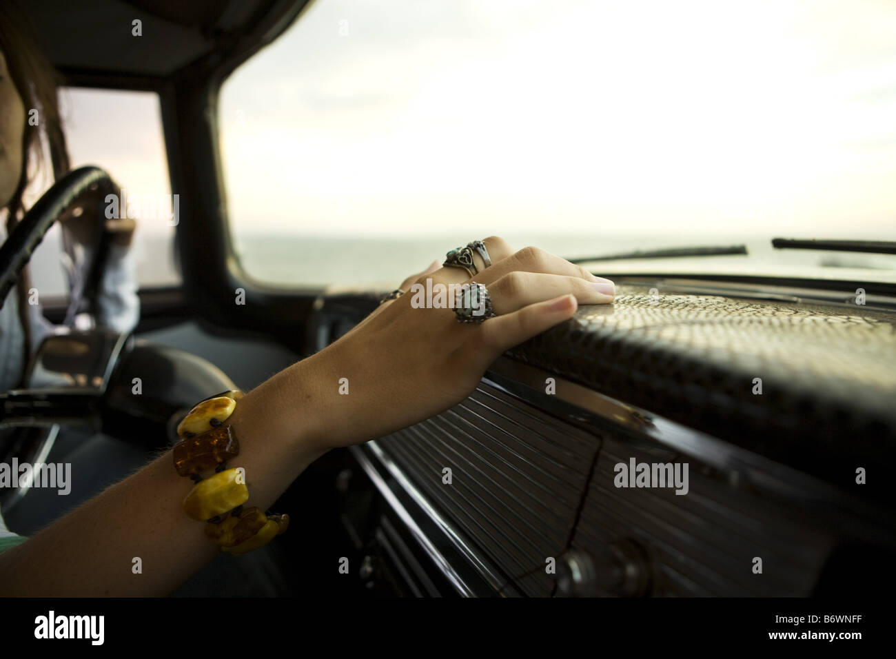 woman's hand with rings on dashboard of vintage car Stock Photo - Alamy