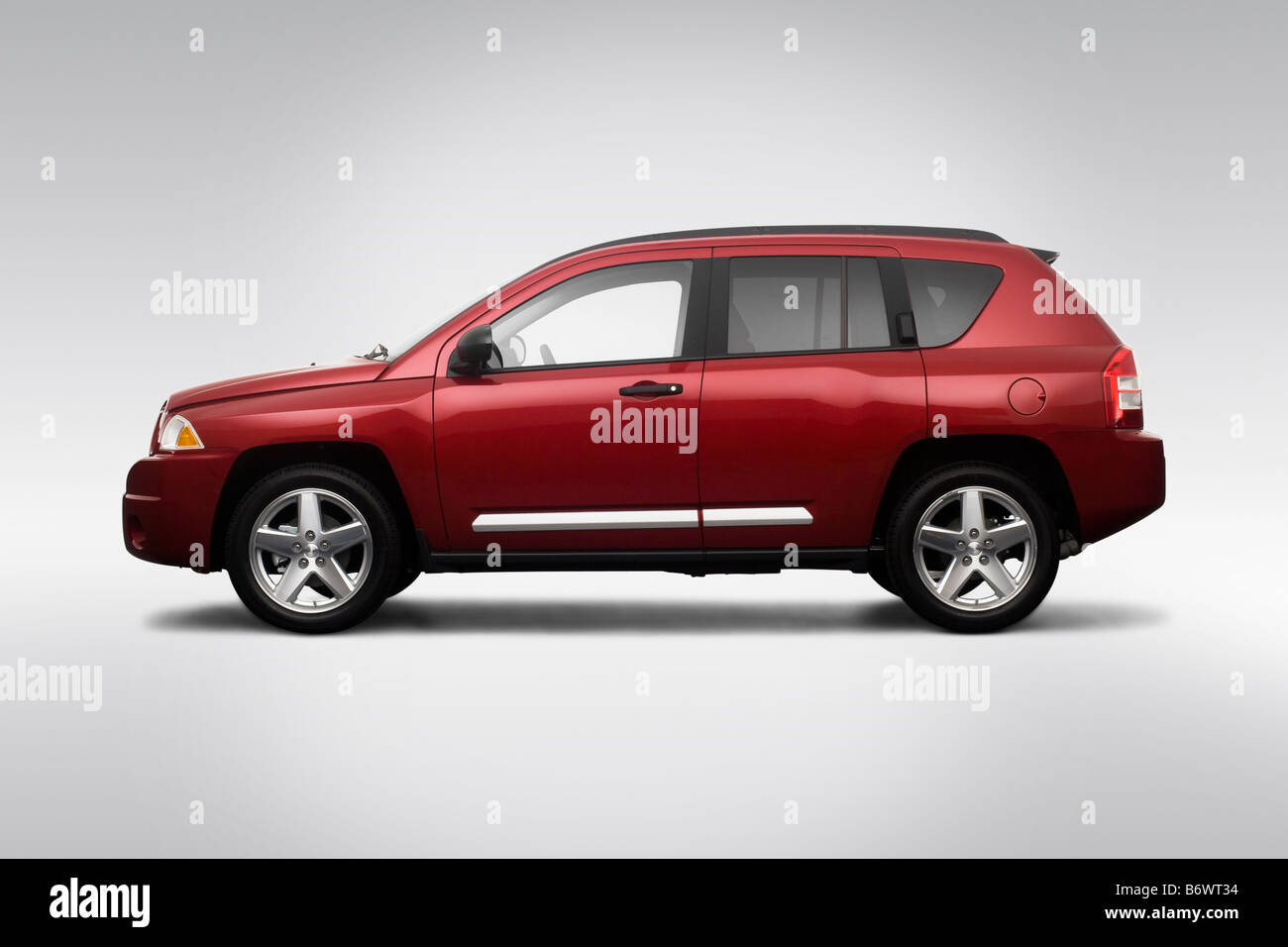 2009 Jeep Compass Limited in Red - Drivers Side Profile Stock Photo - Alamy