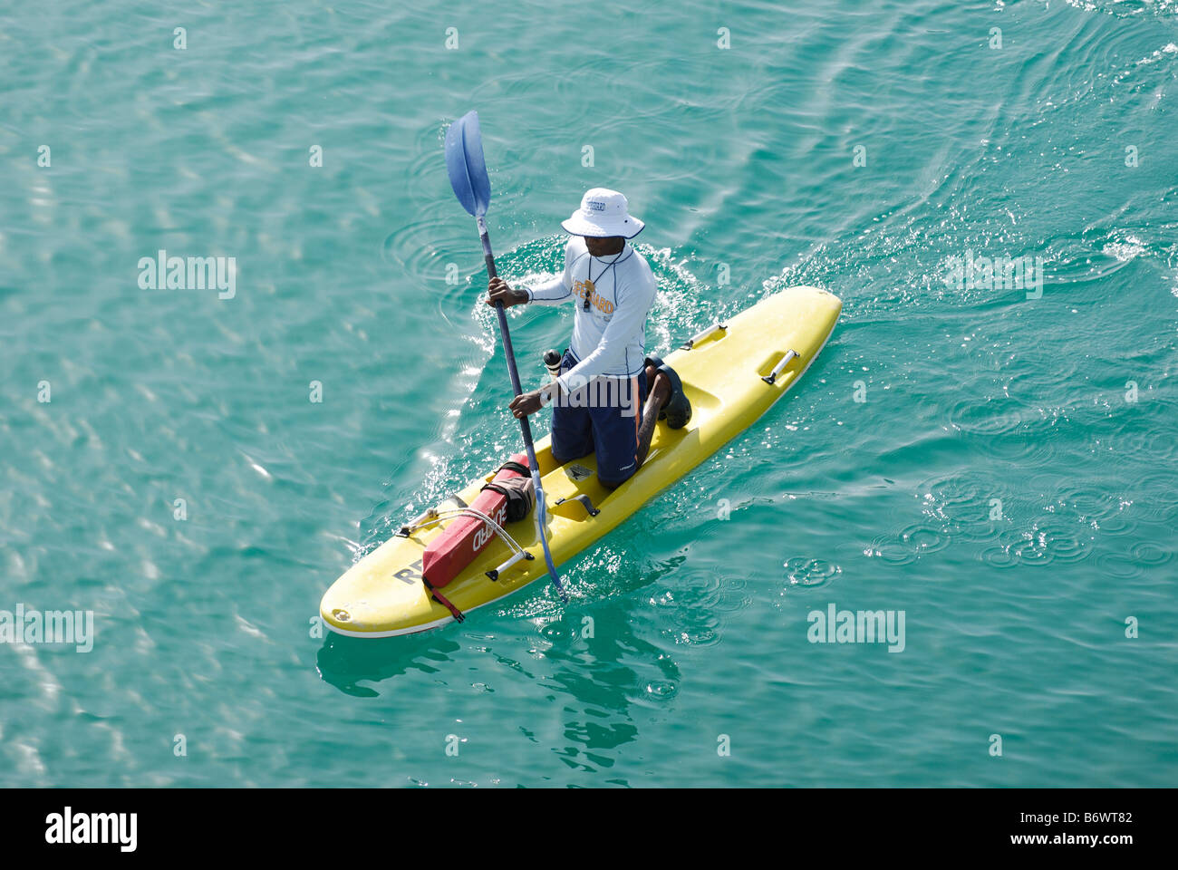 lifeguard paddling yellow kayak blue sea jumeirah beach dubai Stock ...