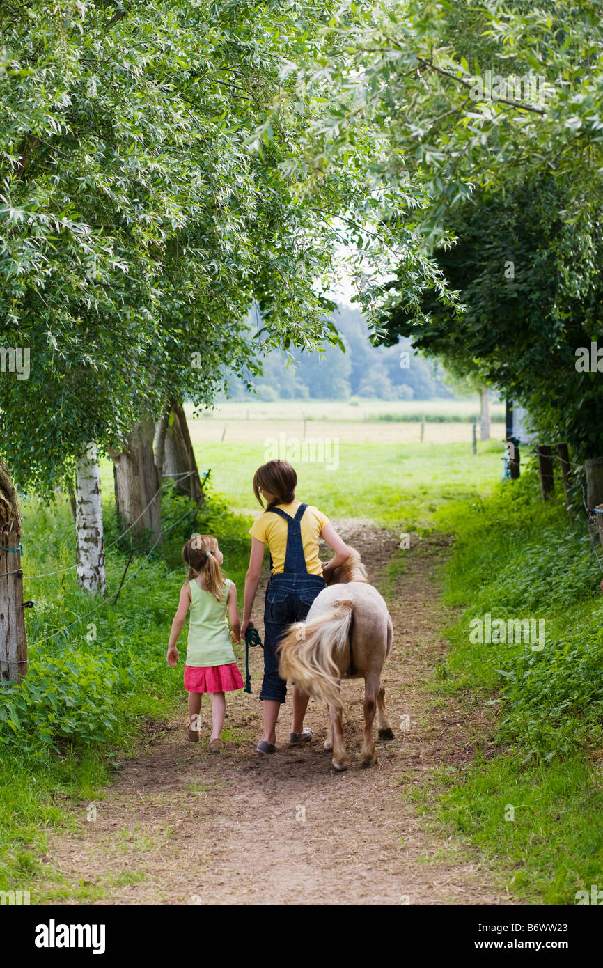 Walking the pony hi-res stock photography and images - Alamy
