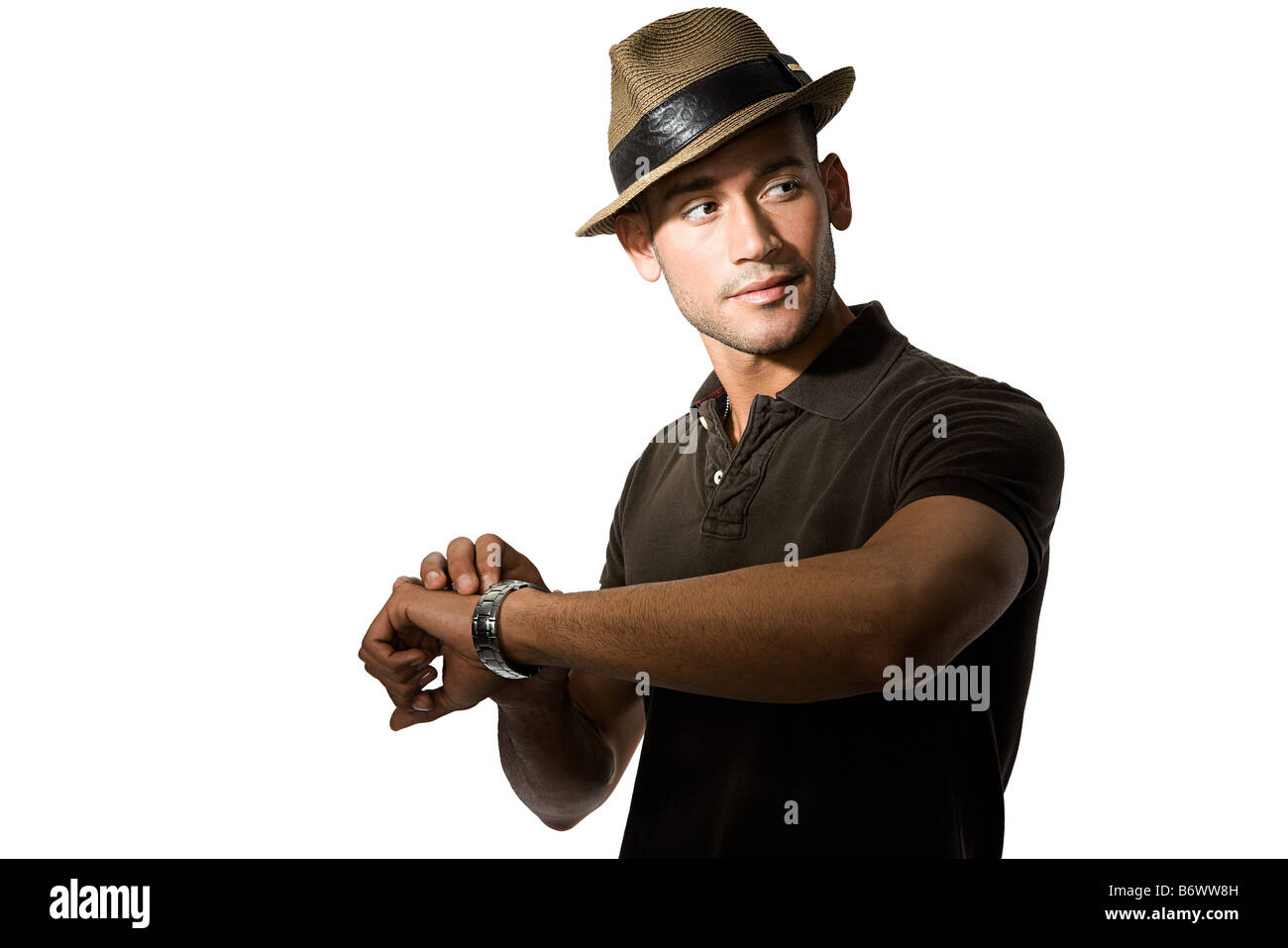 Young man checking his watch Stock Photo - Alamy