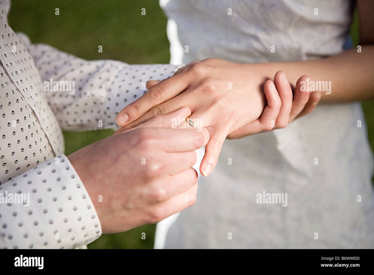 Couple getting married outdoors Stock Photo - Alamy