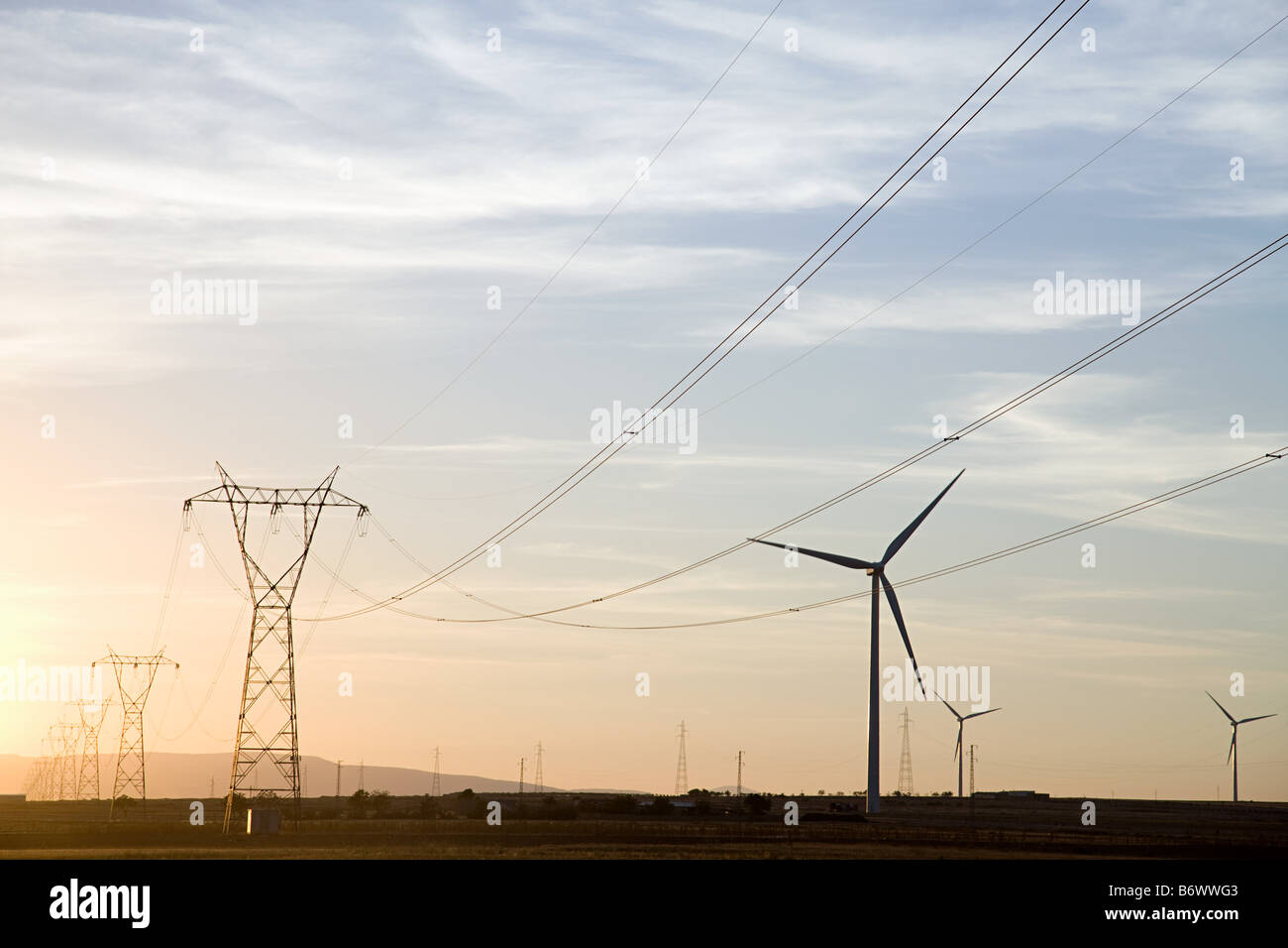 Wind turbines and pylons Stock Photo - Alamy