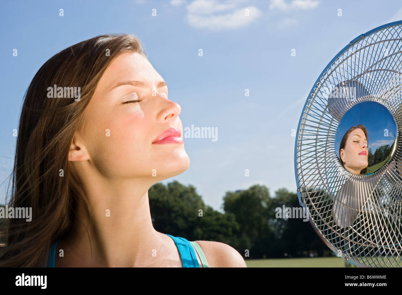 Young woman with fan Stock Photo - Alamy
