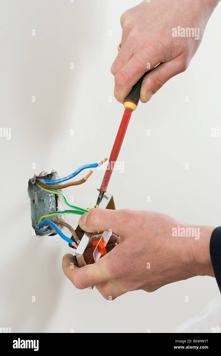 Using an electric socket hi-res stock photography and images - Alamy