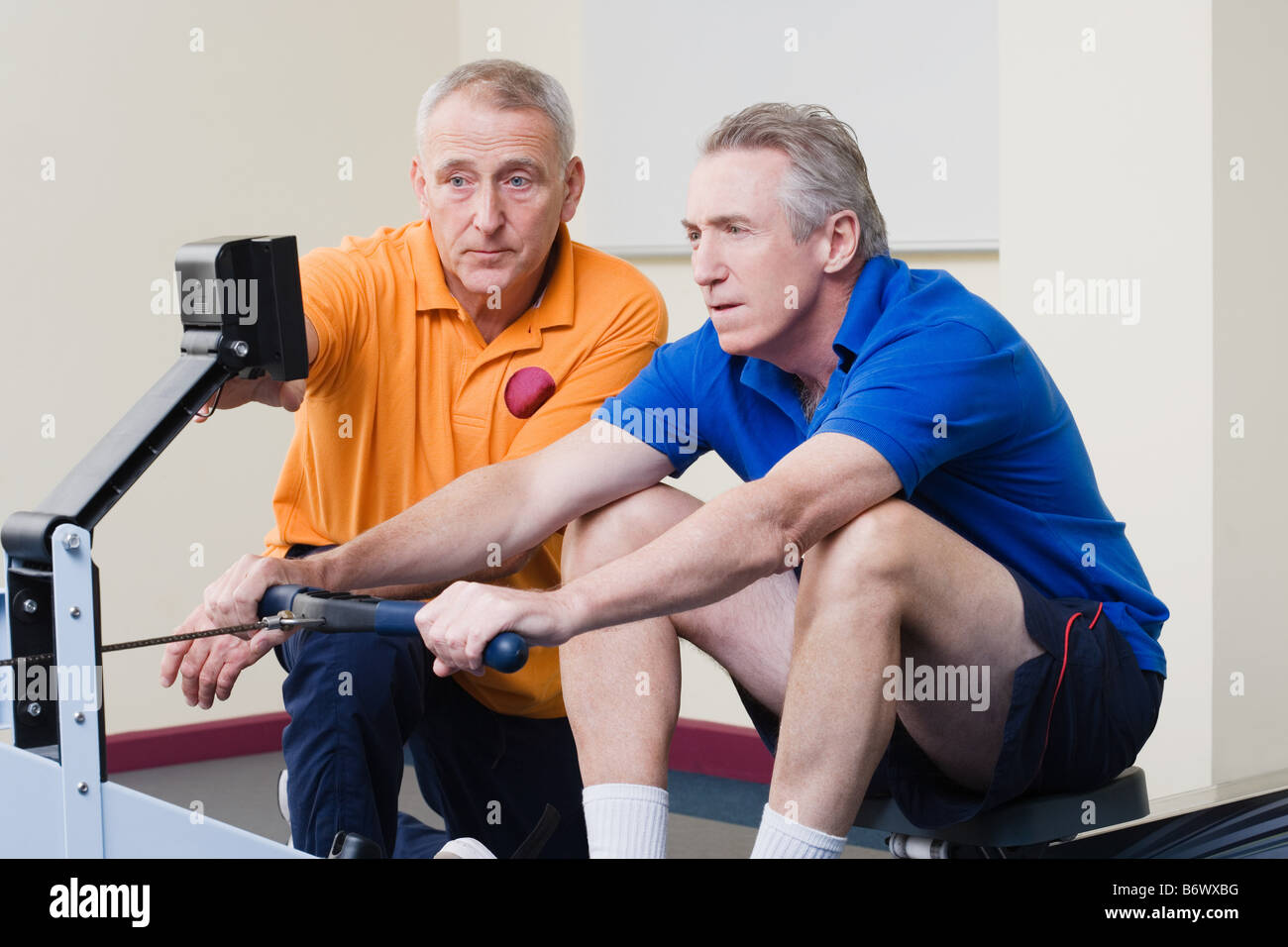 Man on a rowing machine hi-res stock photography and images - Alamy