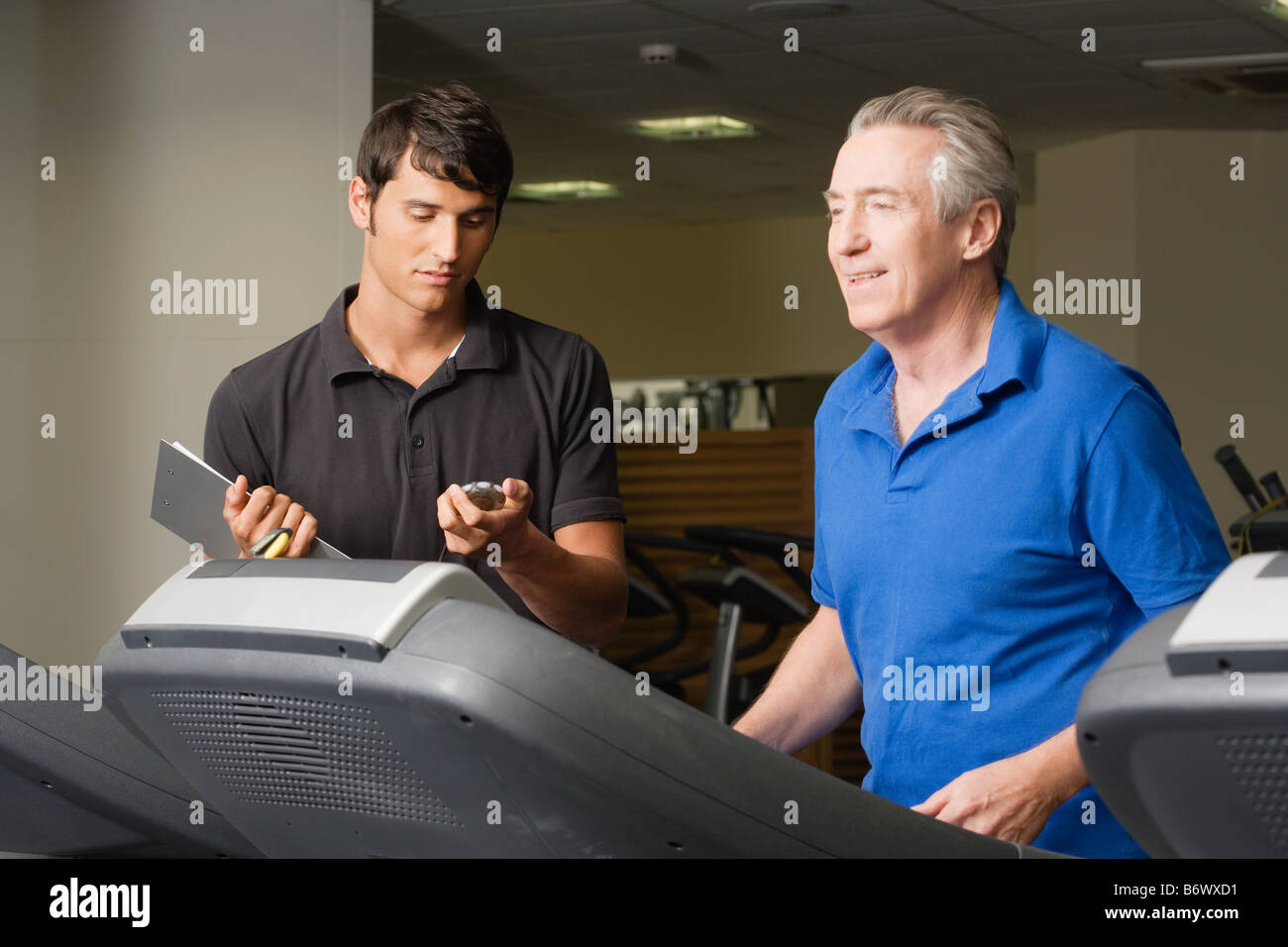 Helping man men male adult adults hi-res stock photography and images ...