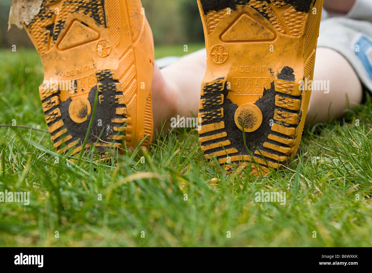 Shoes of child with mud Stock Photo - Alamy
