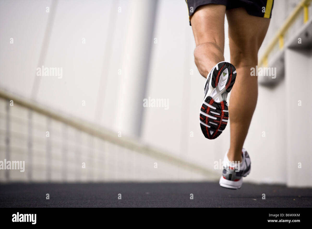 A man running across a bridge Stock Photo - Alamy