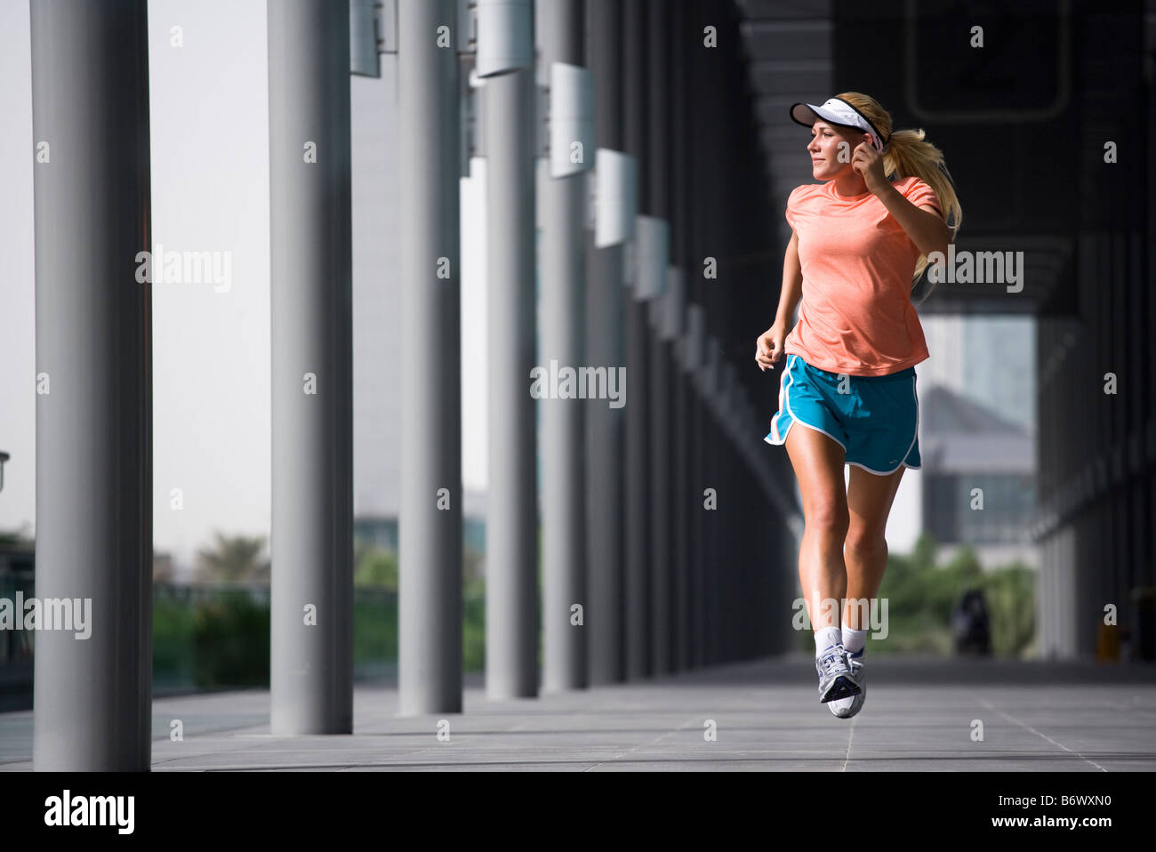A woman running Stock Photo - Alamy