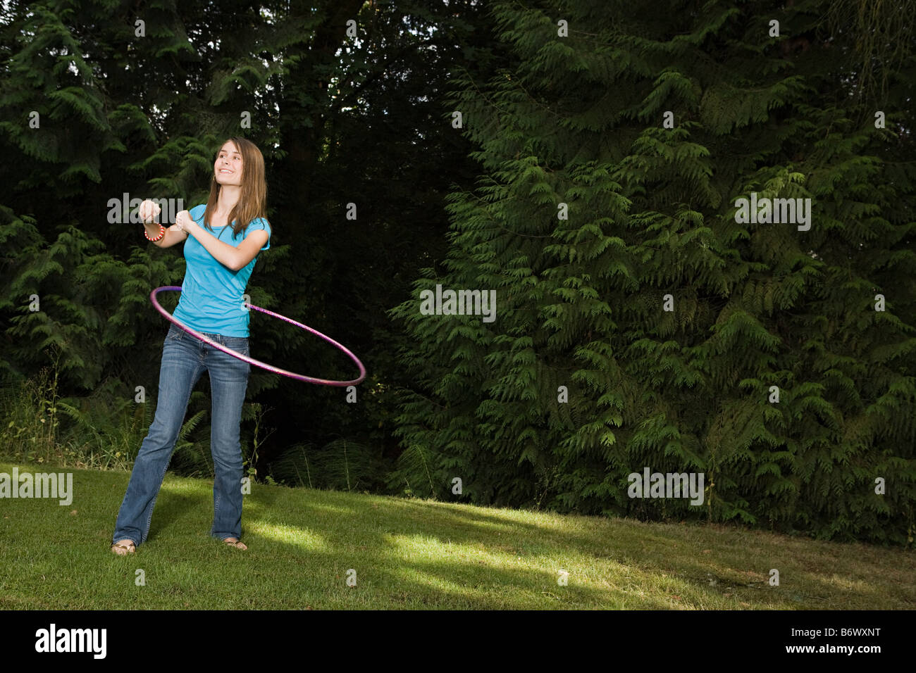 Teenage girl with plastic hoop Stock Photo - Alamy