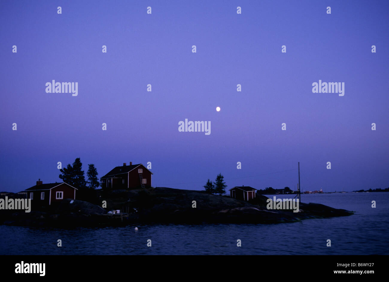 A full midnight moon shines over some of the islands that make up the ...