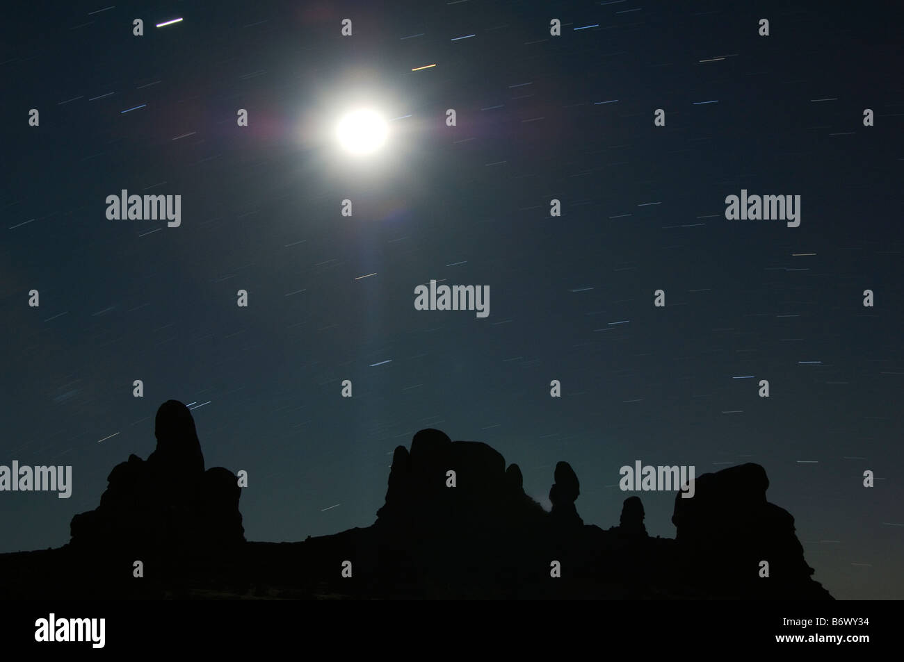 USA, Utah, Arches National Park, night time landscape of star trails ...