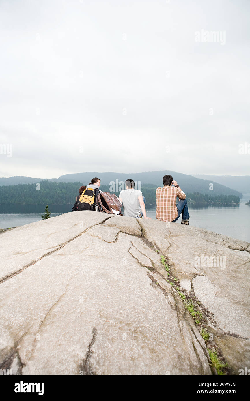 Man and woman sitting on a rock hi-res stock photography and images - Alamy