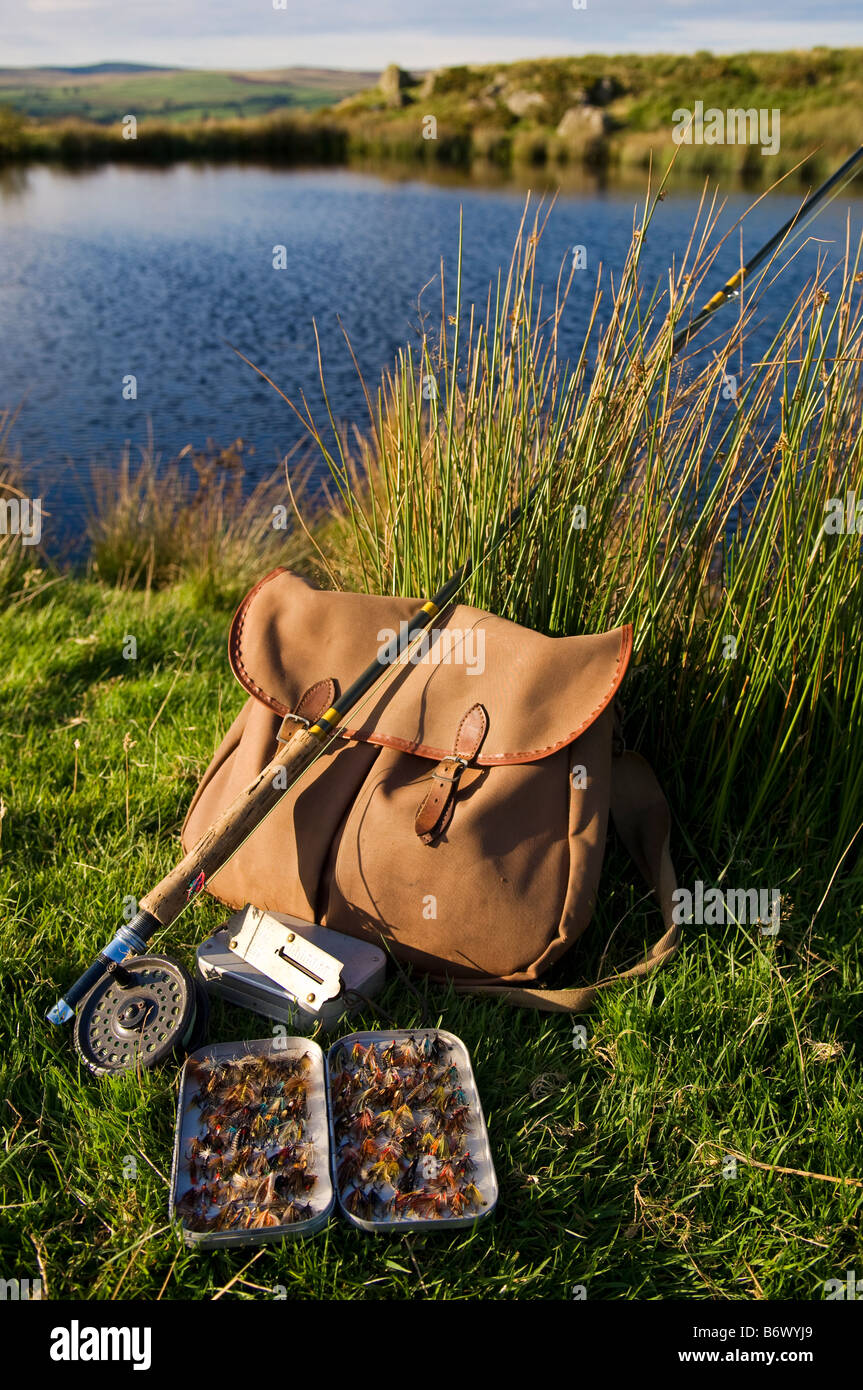 UK, Wales, Conwy. A trout rod and fly fishing equipment beside a hill ...