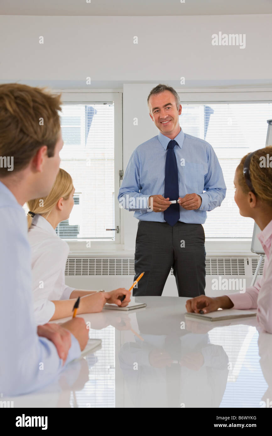 A lecturer teaching business students Stock Photo - Alamy