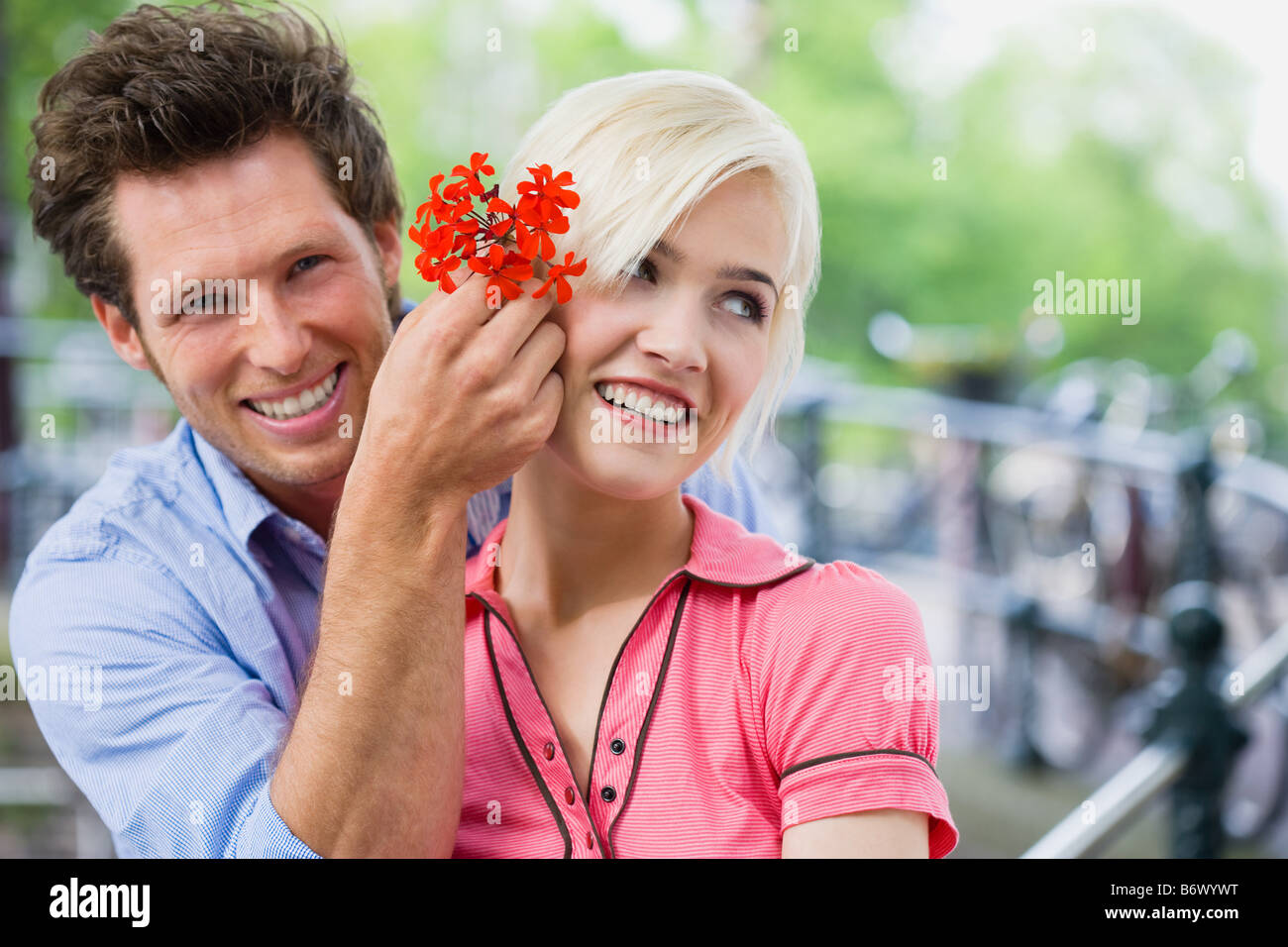 Couple with flowers Stock Photo - Alamy