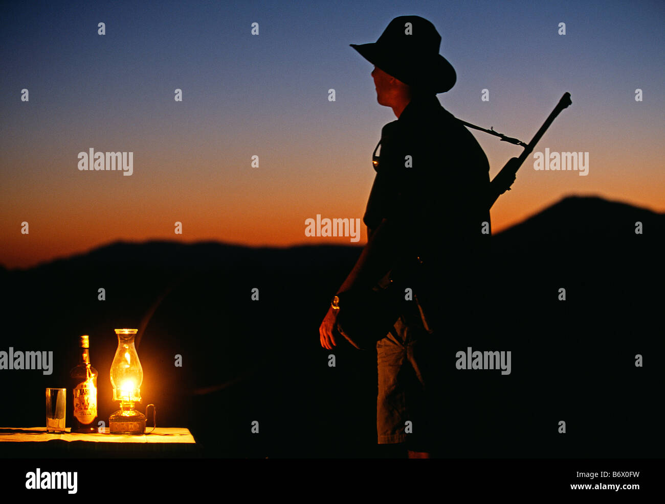 Zambia, Lower Zambezi National Park. Sundowners in the bush, looking ...
