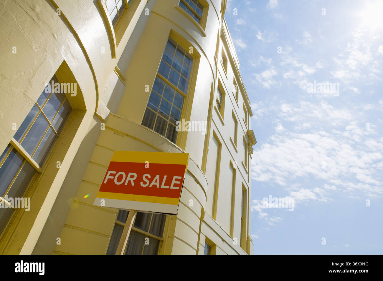 Building and for sale sign Stock Photo - Alamy