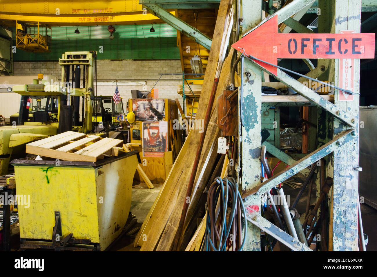 An arrow sign in a warehouse Stock Photo - Alamy