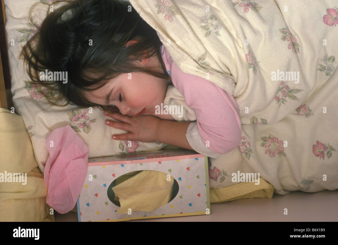 child with cold sleeping in bed Stock Photo - Alamy