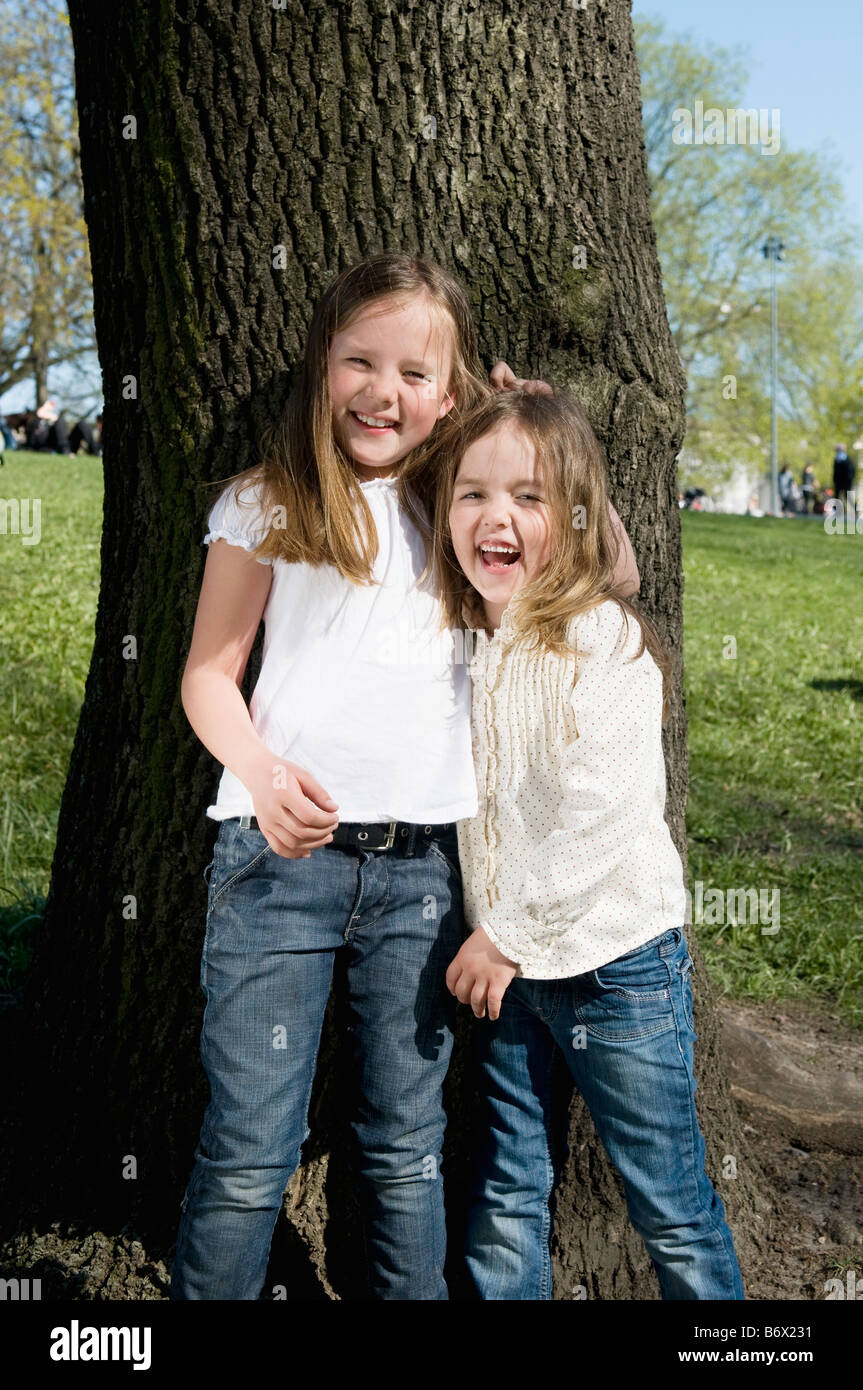 Sisters standing together Stock Photo - Alamy
