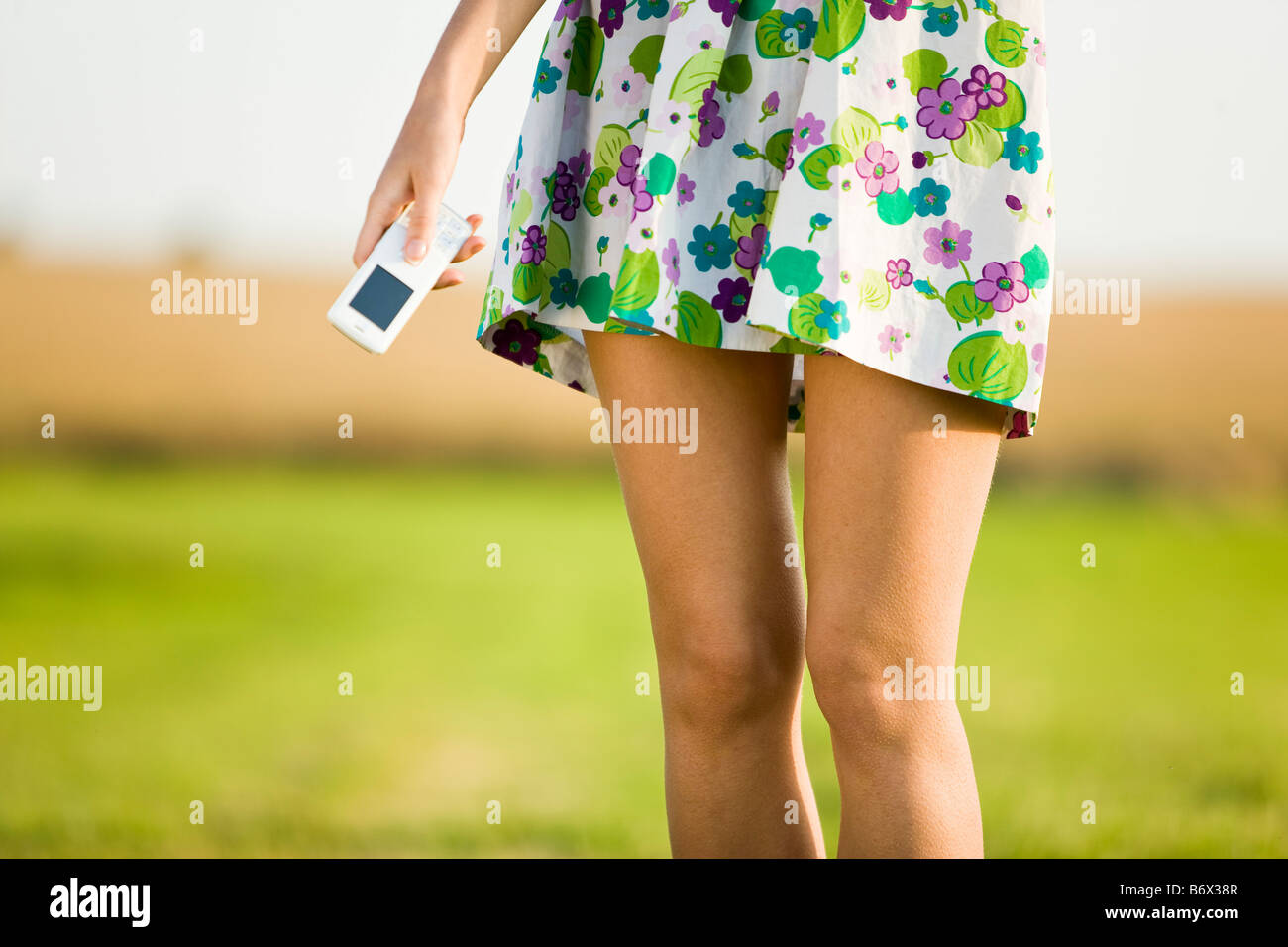 Woman holding up cell hi-res stock photography and images - Alamy