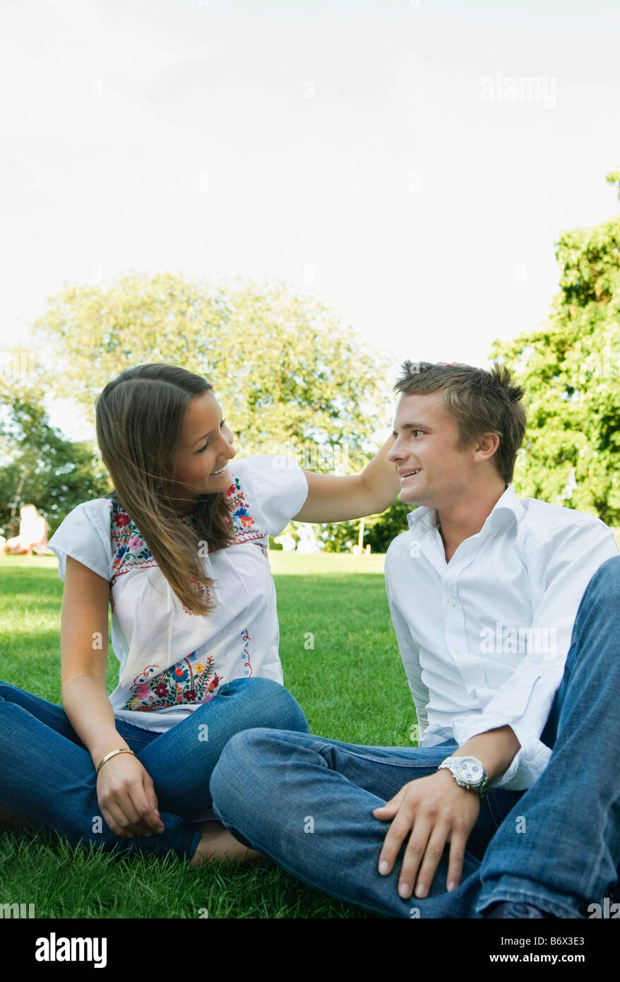 Sibblings on lawn Stock Photo - Alamy