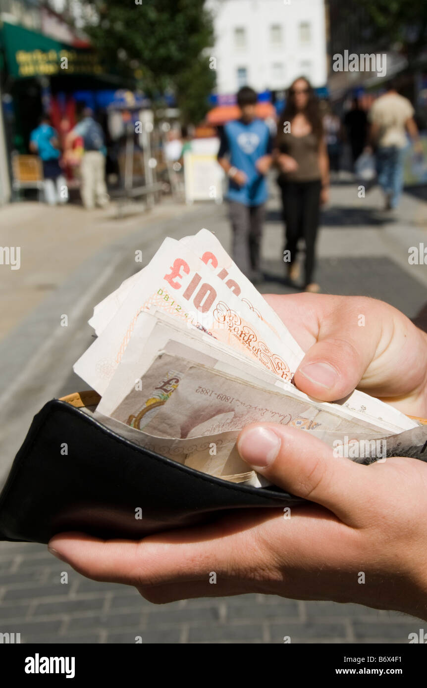 Wallet full of cash hi-res stock photography and images - Alamy