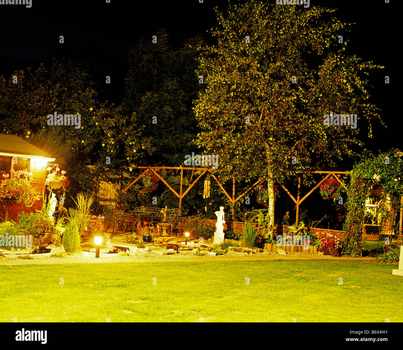 LIGHTING UP THE GARDEN AT NIGHT Stock Photo - Alamy
